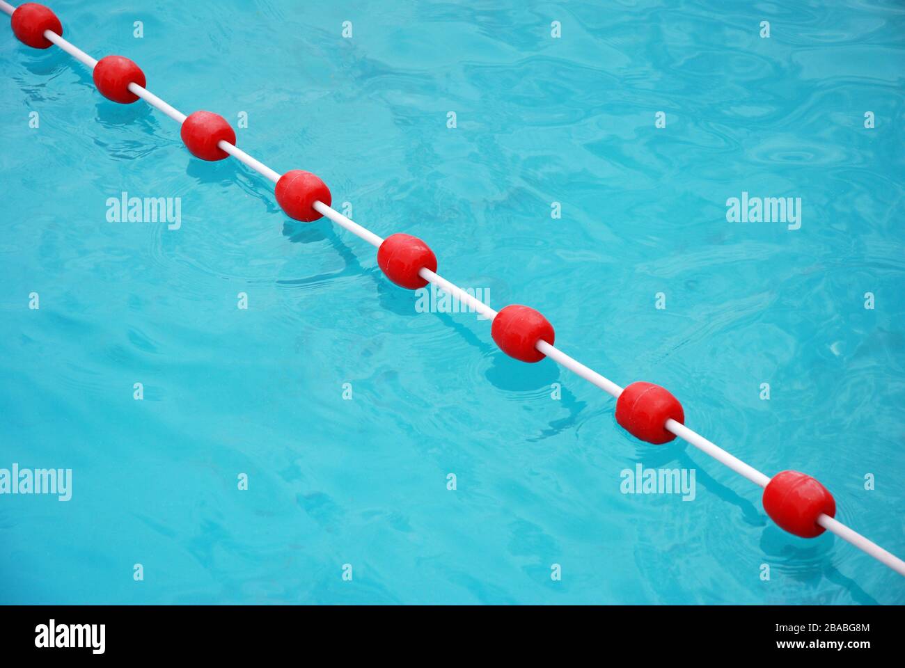 Swimmingpool abstract with border rope and red dots Stock Photo - Alamy