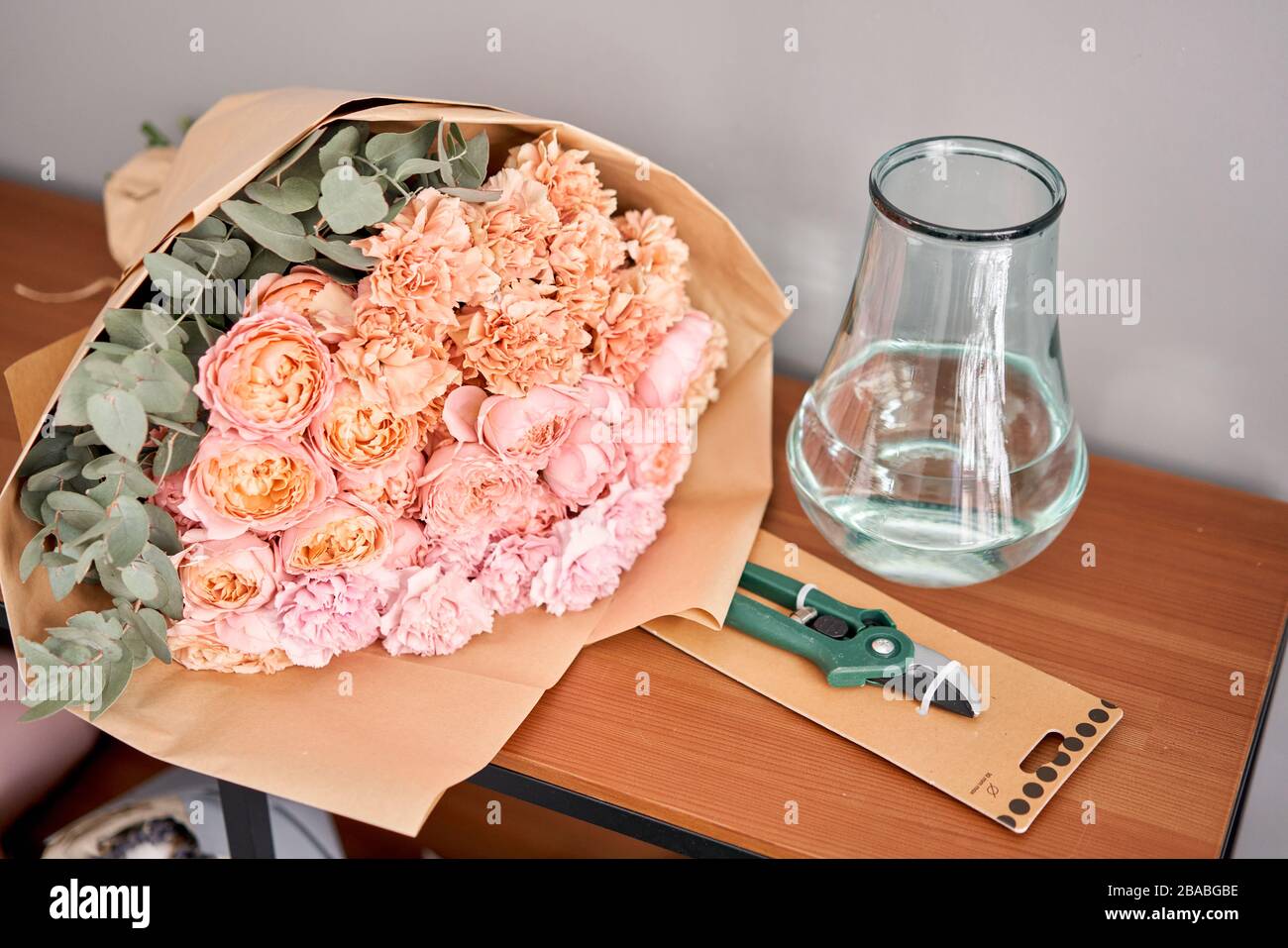 Flower set on wooden table. Fresh cut flowers for decoration home ...