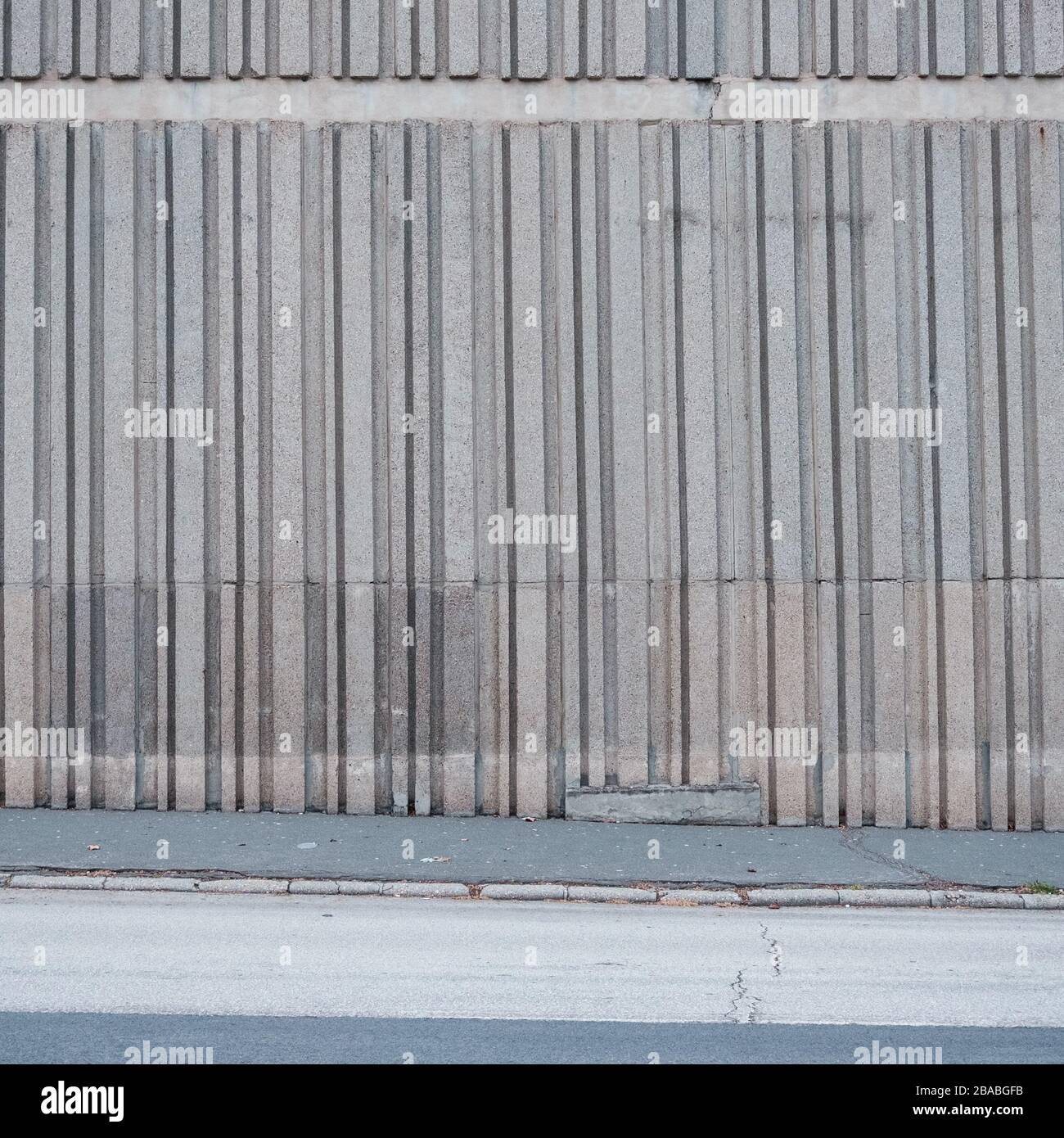 social distance - grey stone wall with sidewalk Stock Photo - Alamy