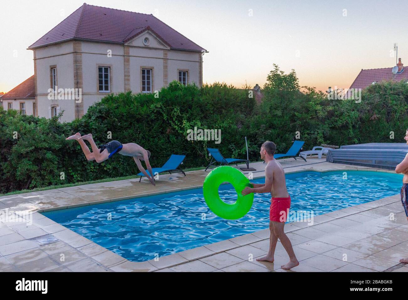 People Playing In And Around A Swimming Pool In Burgundy, France Stock ...
