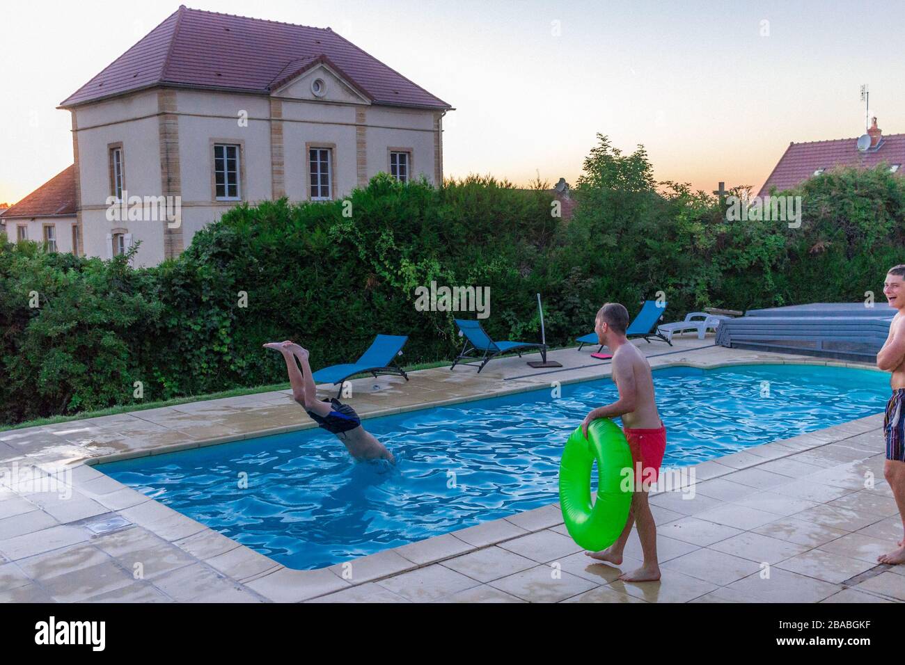 People Playing In And Around A Swimming Pool In Burgundy, France Stock ...