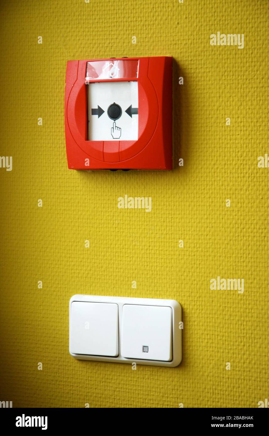 Indoor fire alarm infrastructure on a yellow wall Stock Photo - Alamy