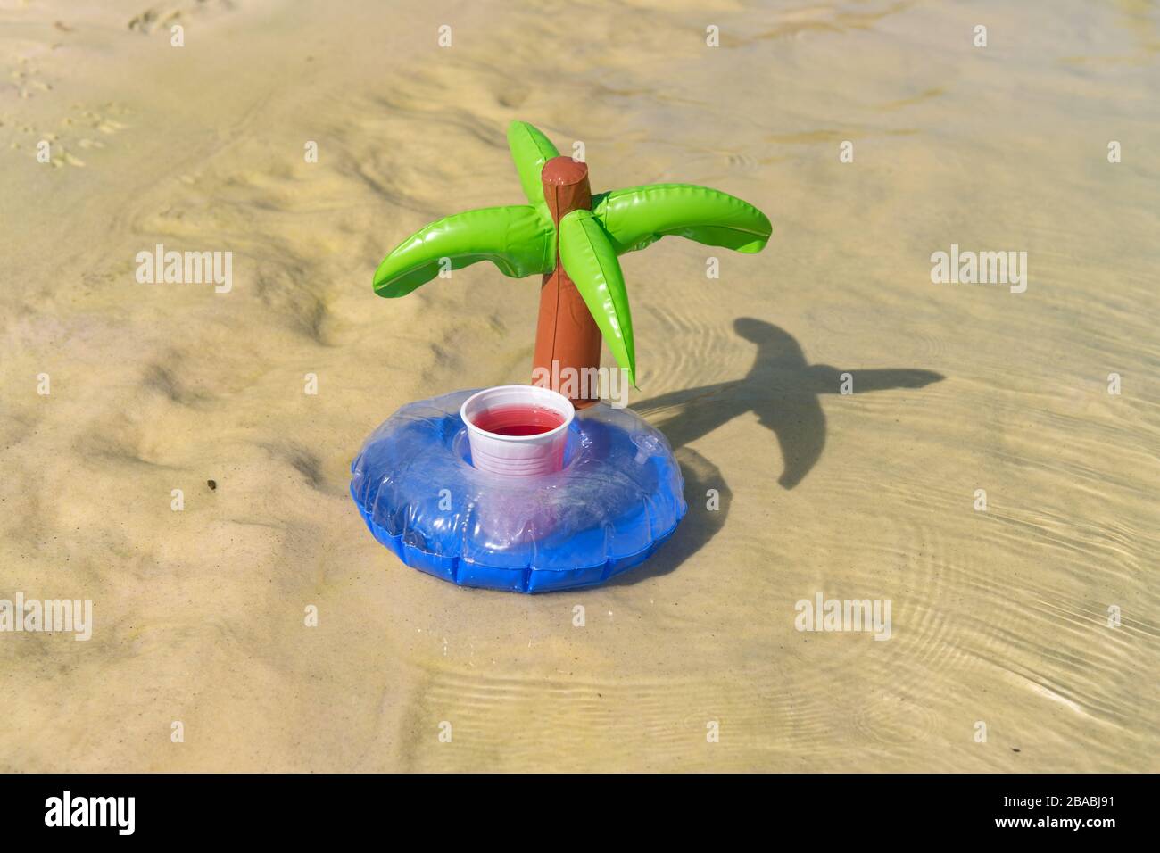 Inflatable Palm tree with cocktail drink Stock Photo - Alamy