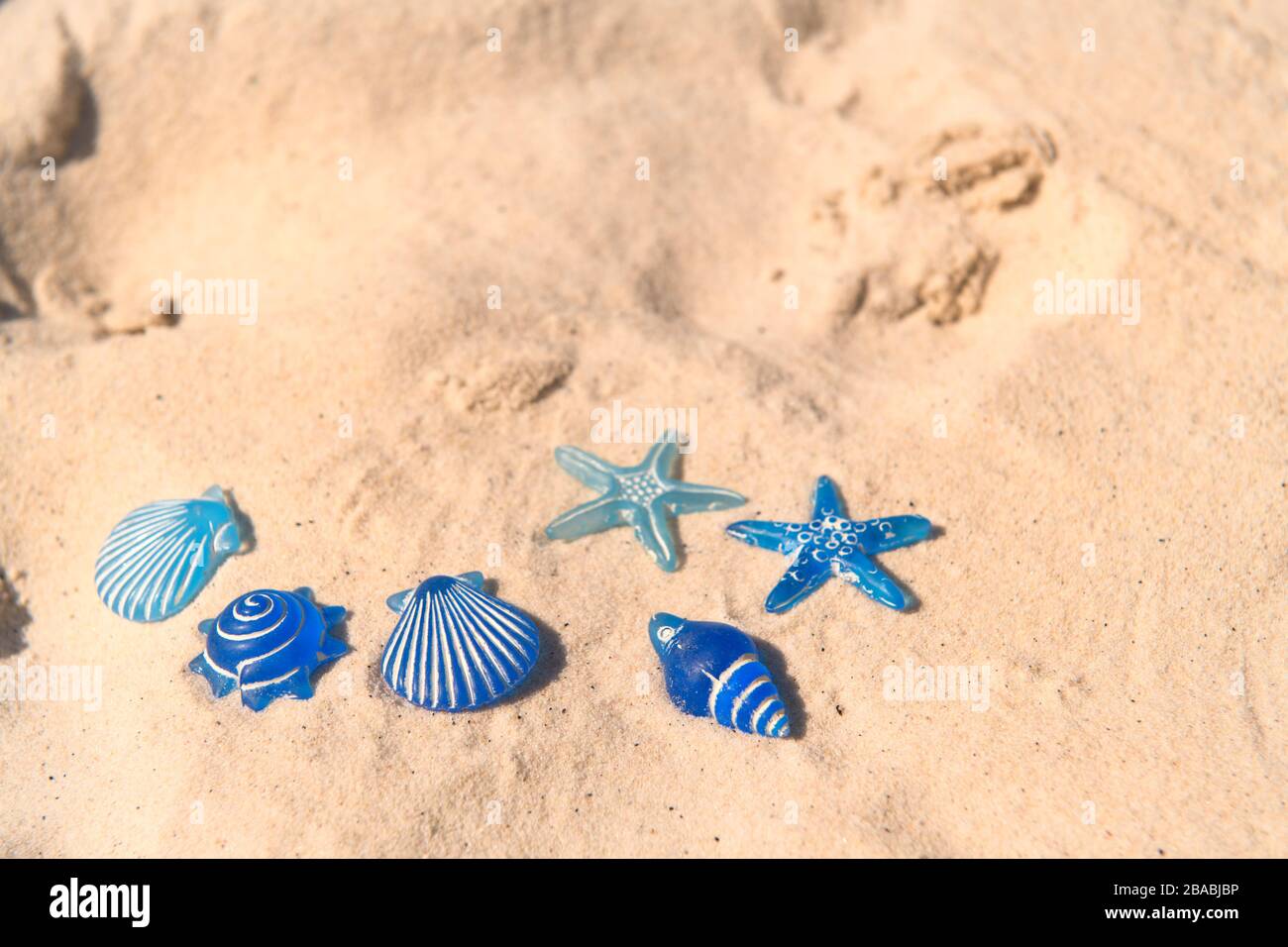 Blue Star fishes in sand at beach Stock Photo - Alamy