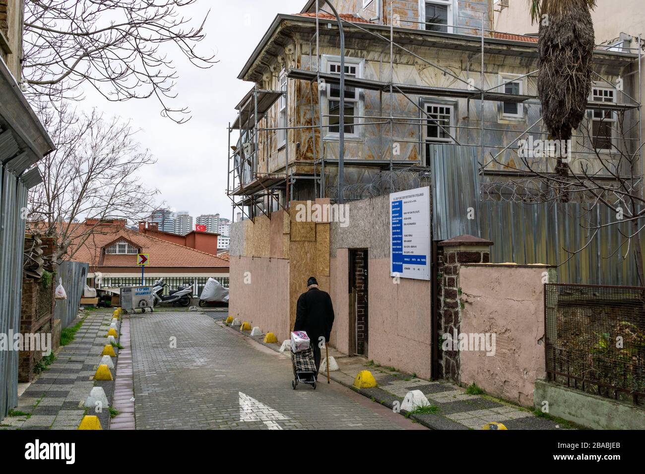 Returning from shopping,old man walks down the street in Kadikoy Stock ...