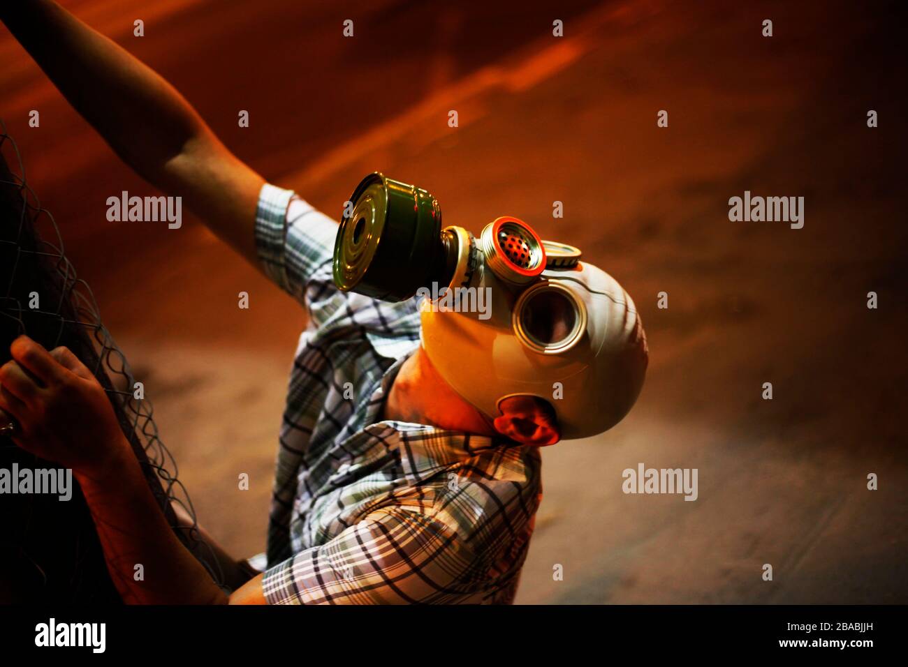 Man in a gas mask on night street Stock Photo - Alamy