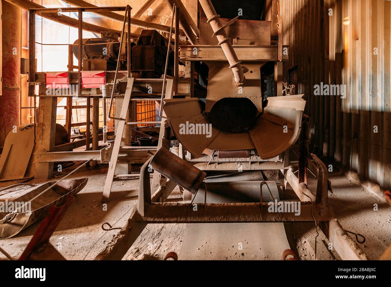 Old dirty dusty abandoned cement factory with remnant of equipment ...