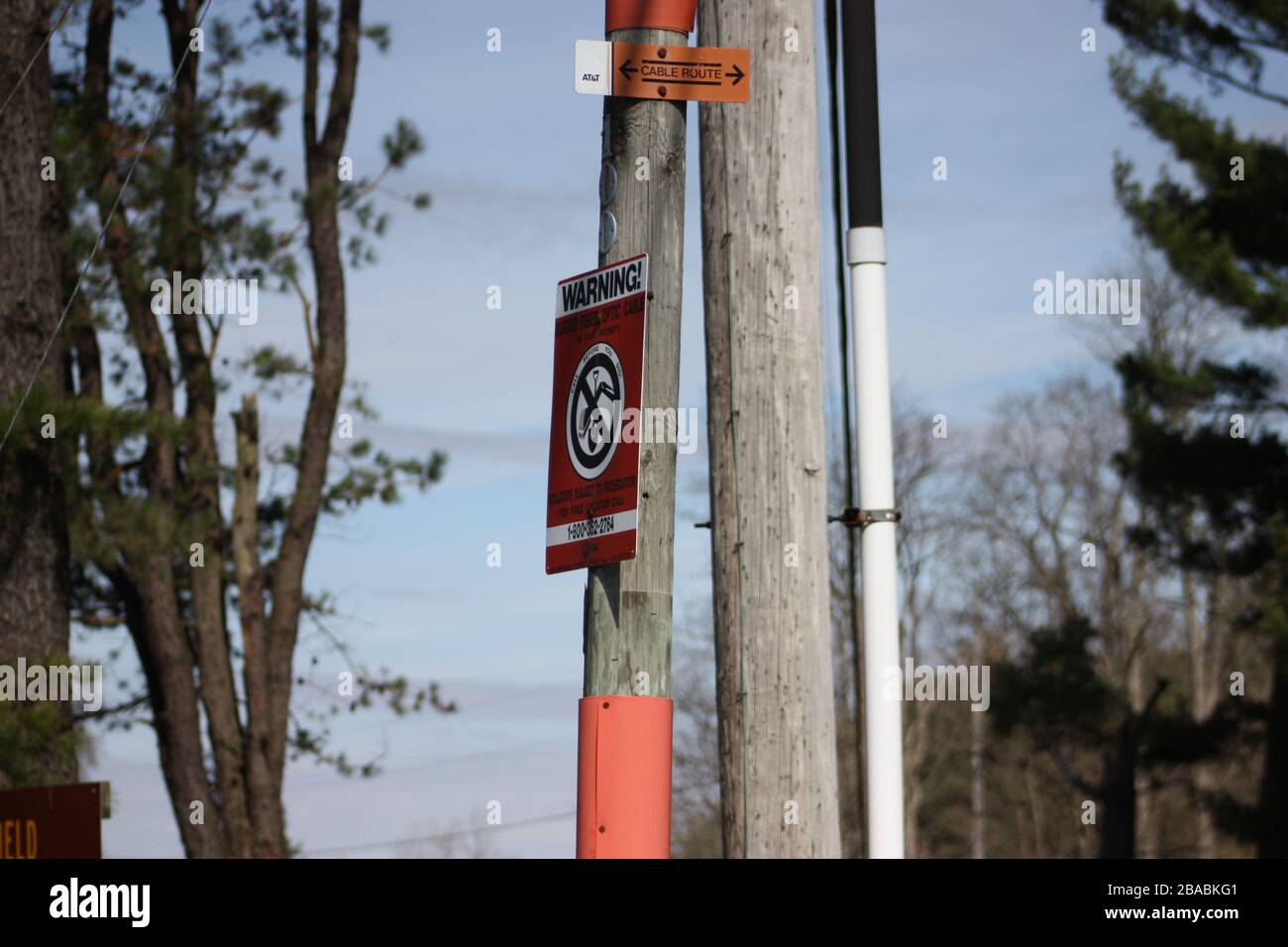 Warning Sign on Pole Stock Photo - Alamy