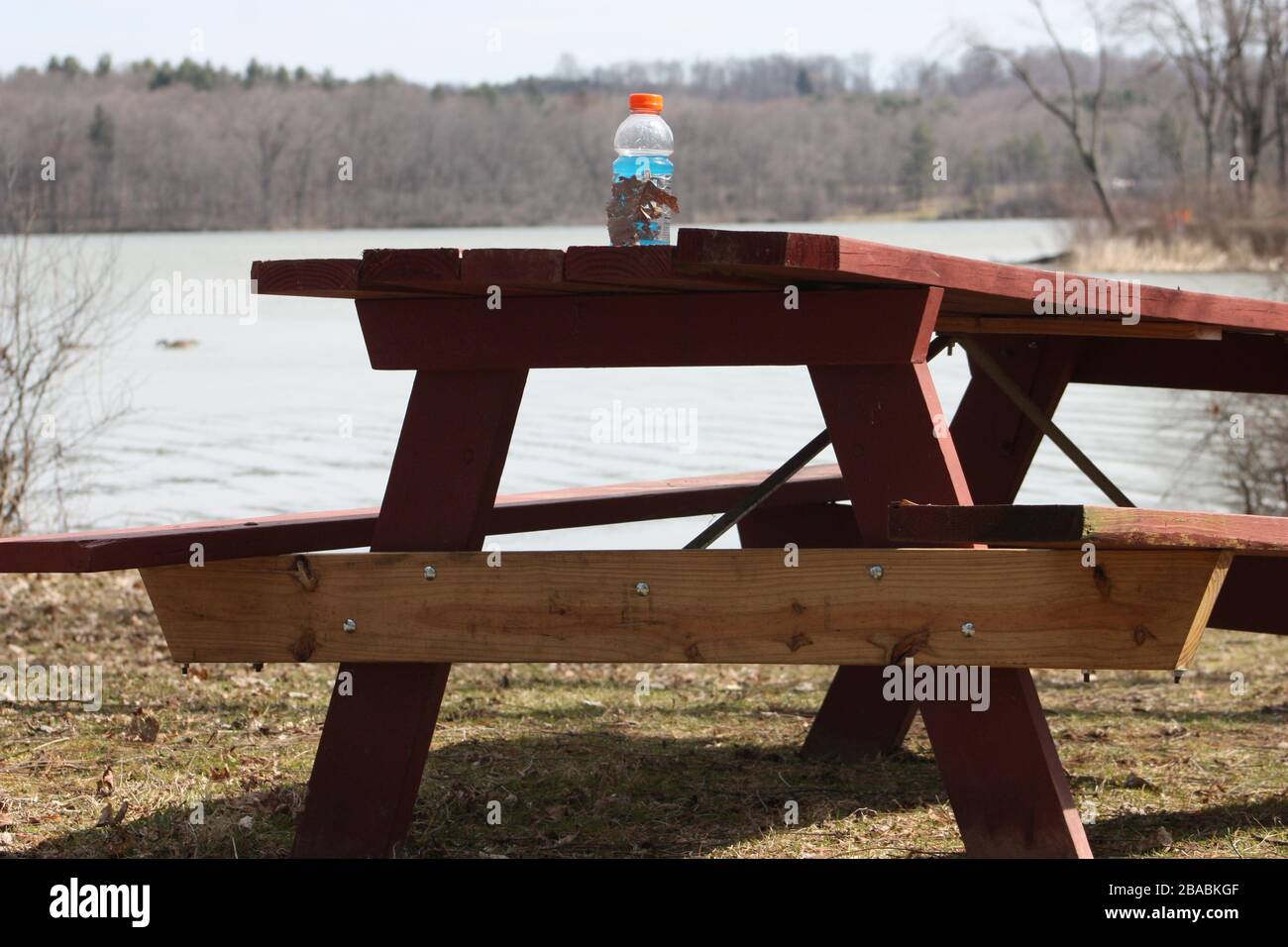 Bottle on Picnic Table Stock Photo - Alamy