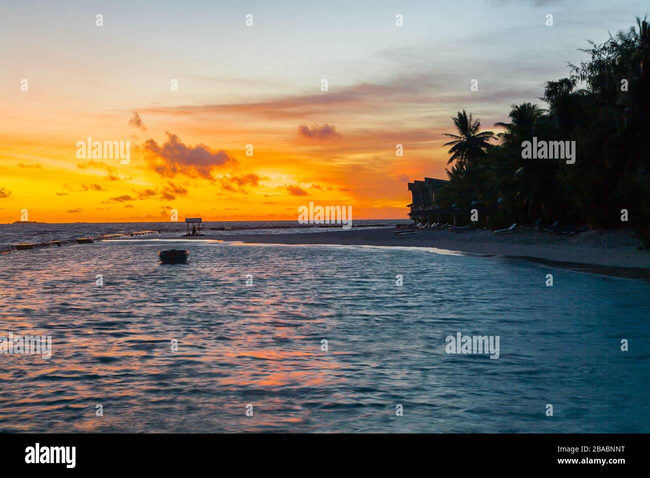Sunset on Maldives, tropical island Stock Photo - Alamy