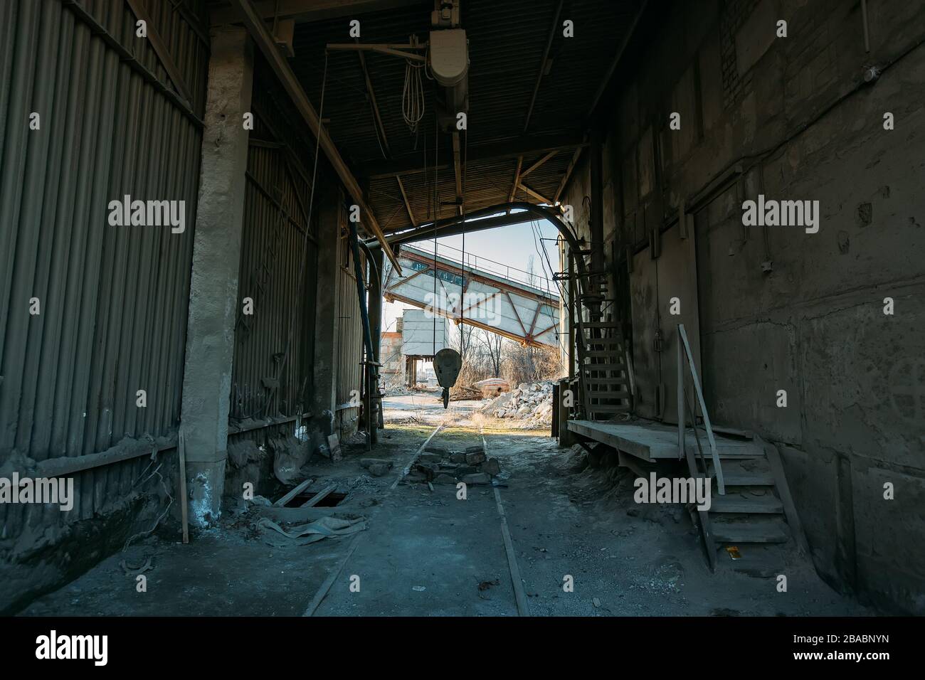 Old dirty dusty abandoned cement factory with remnant of equipment ...