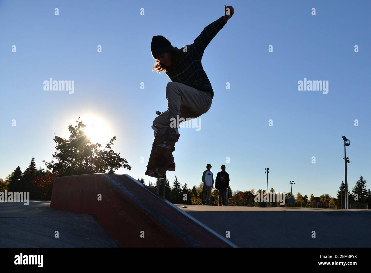 Silhouette of a boy skateboarding in the skatepark Stock Photo - Alamy