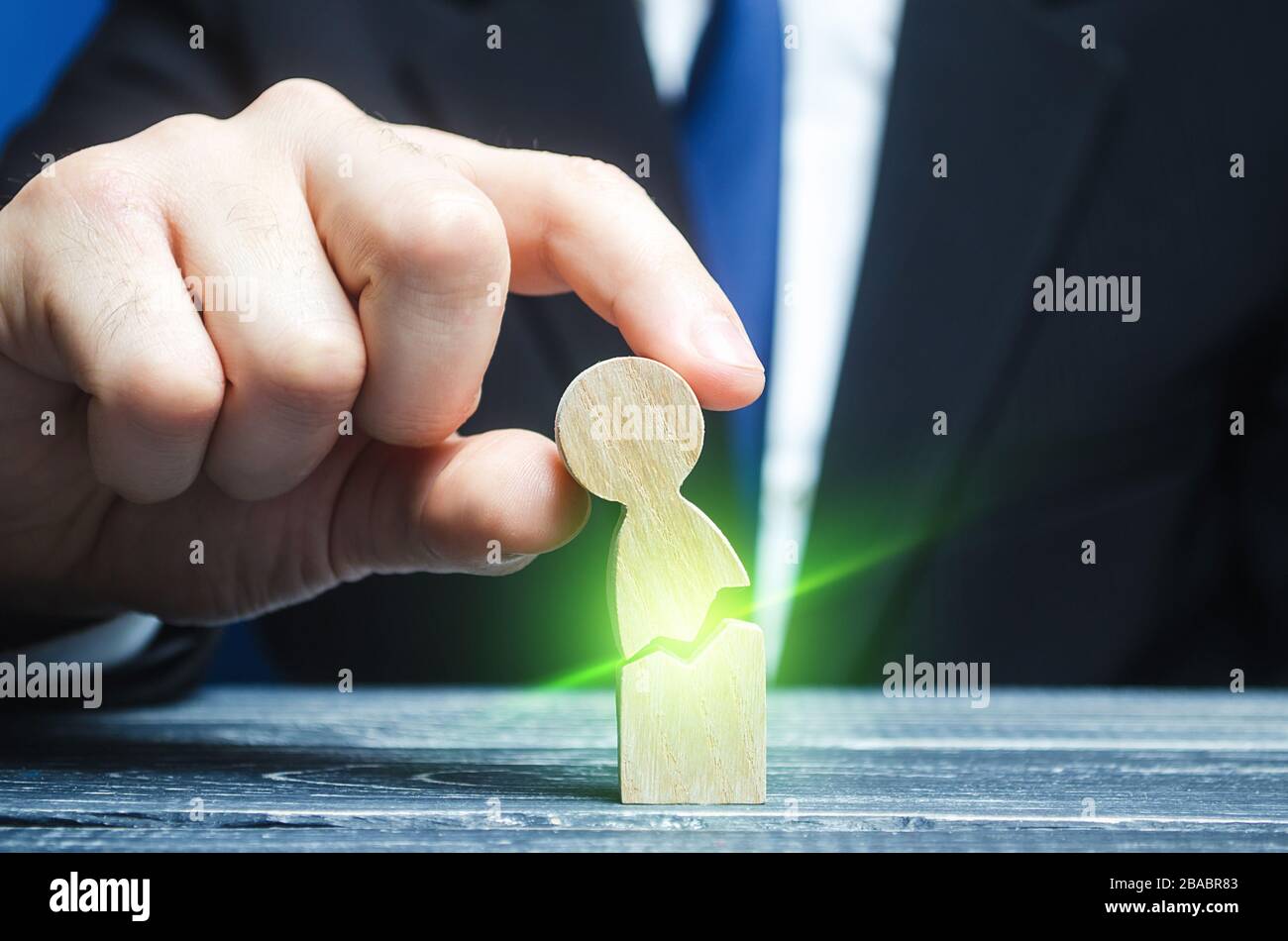 Man unites together a broken human figure. Medical healing , victory ...