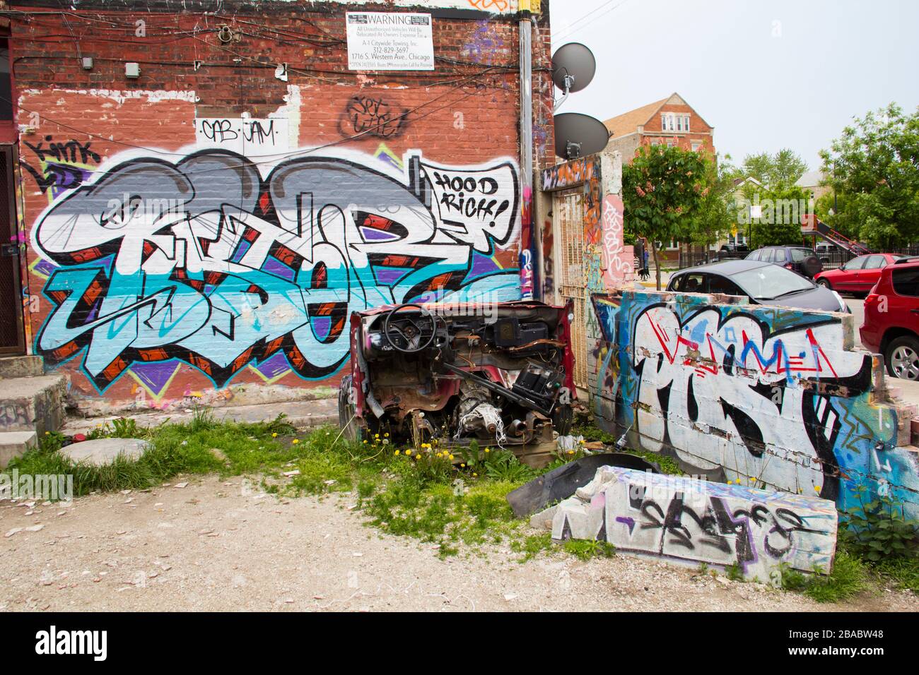 Colorful mural on wall and car wreck, Pilsen, Chicago, Illinois, USA ...
