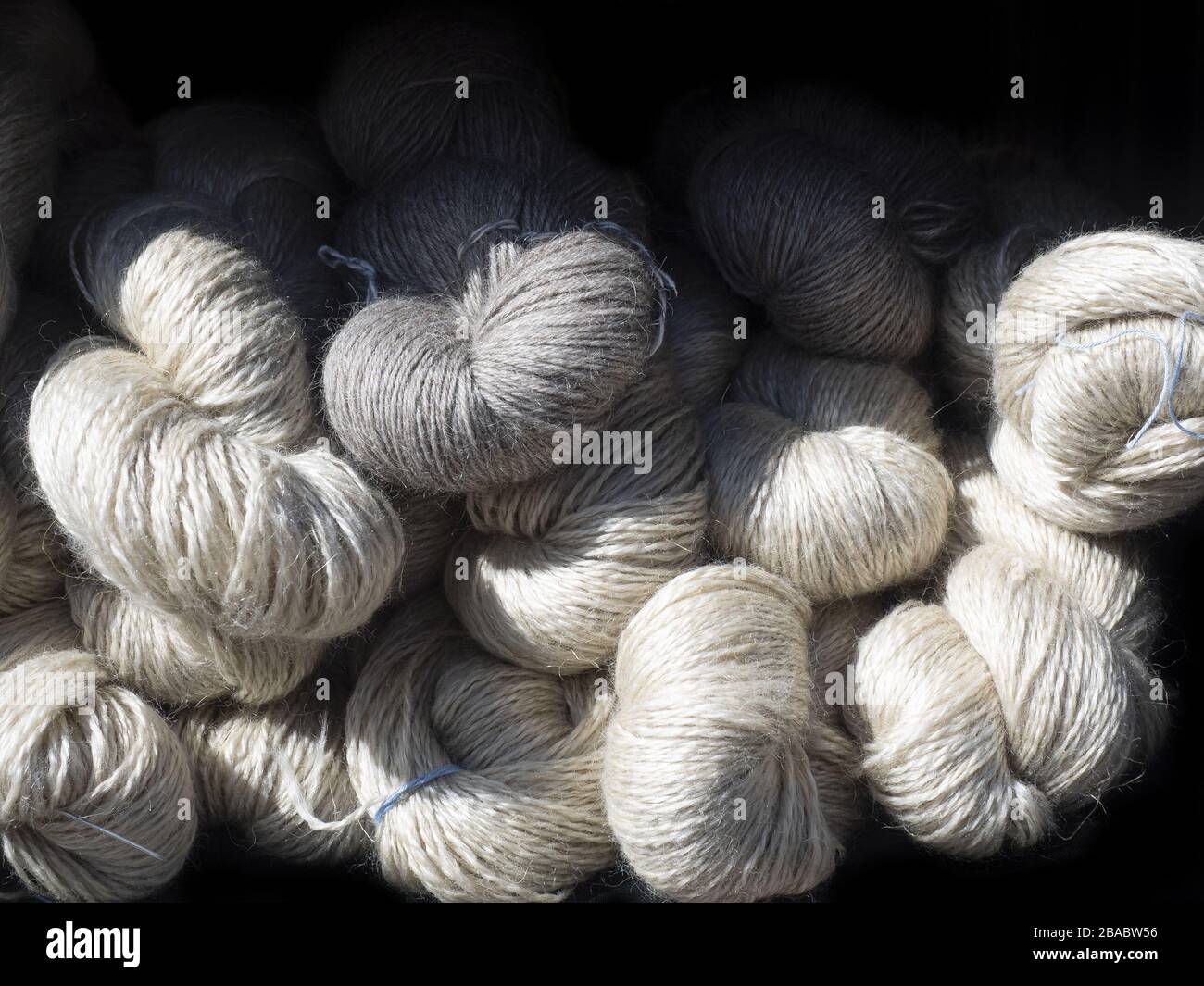 group of soft wool clew in natural colors produced with traditional ...
