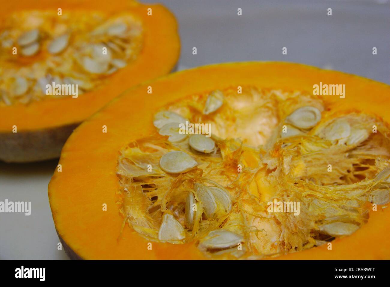 Close-up of an open pumpkin showing the detail of natural pumpkin seeds ...