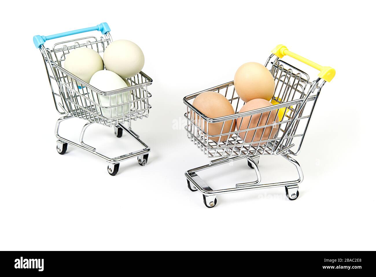 chicken colored eggs in a shopping cart. isolated on white Stock Photo ...