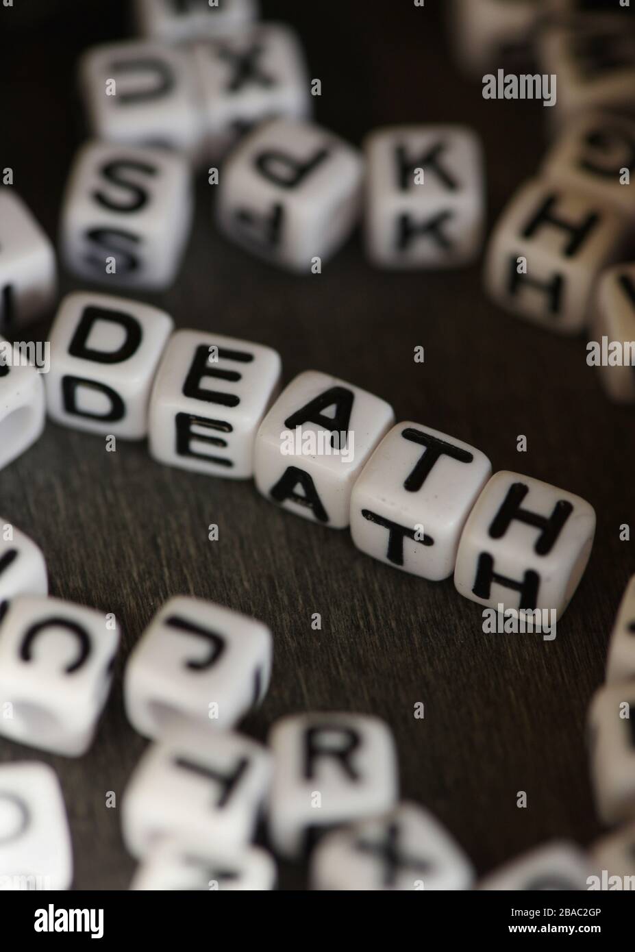 Still life showing black and white letter blocks spelling out the word ...