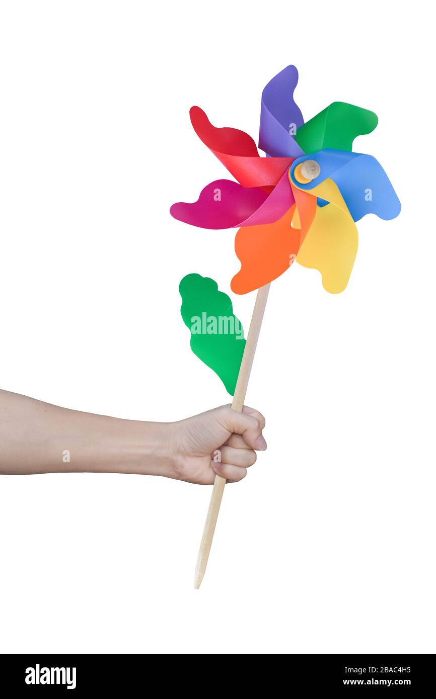 Hand holding wind turbine (Toy play) isolated on white background ...