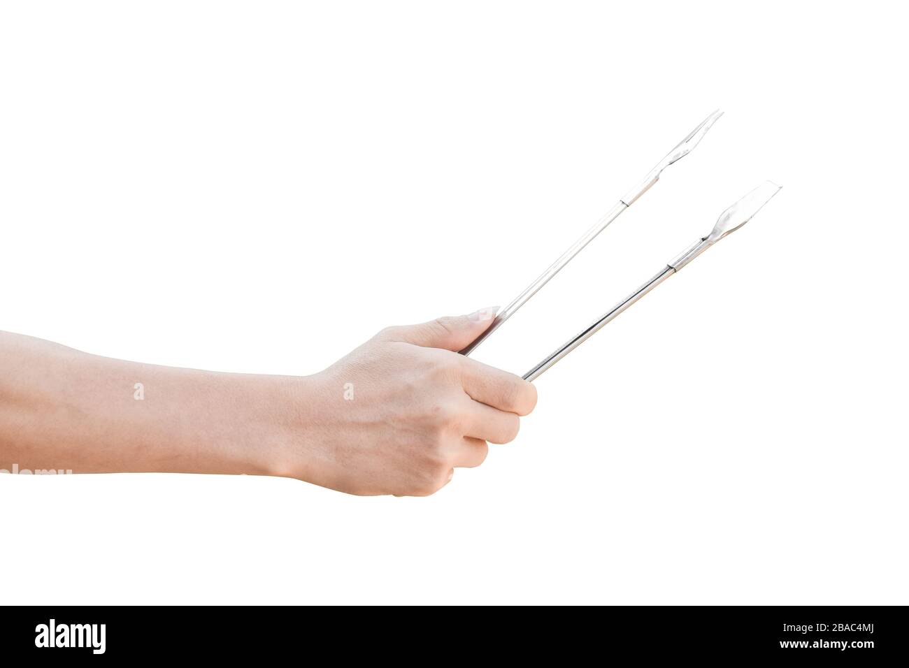 Hand holding kitchen tongs isolated on white background with clipping ...