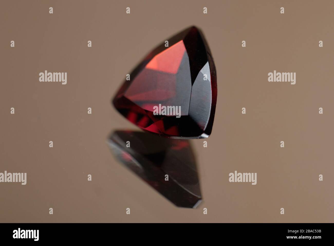 Gemstone ruby on a glass table. Close up Stock Photo - Alamy