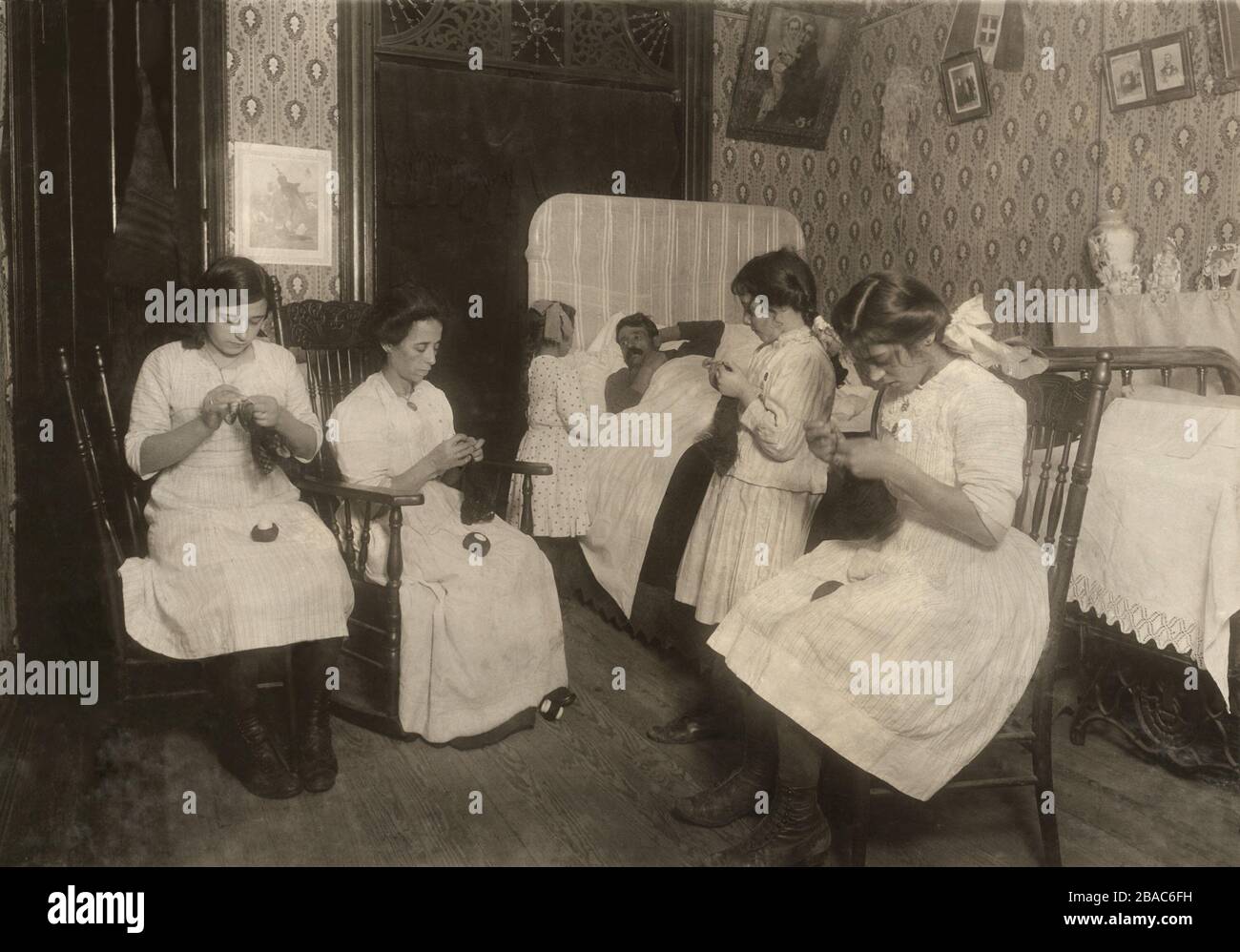 Italian-American family doing 'homework' in their apartment, with the ...