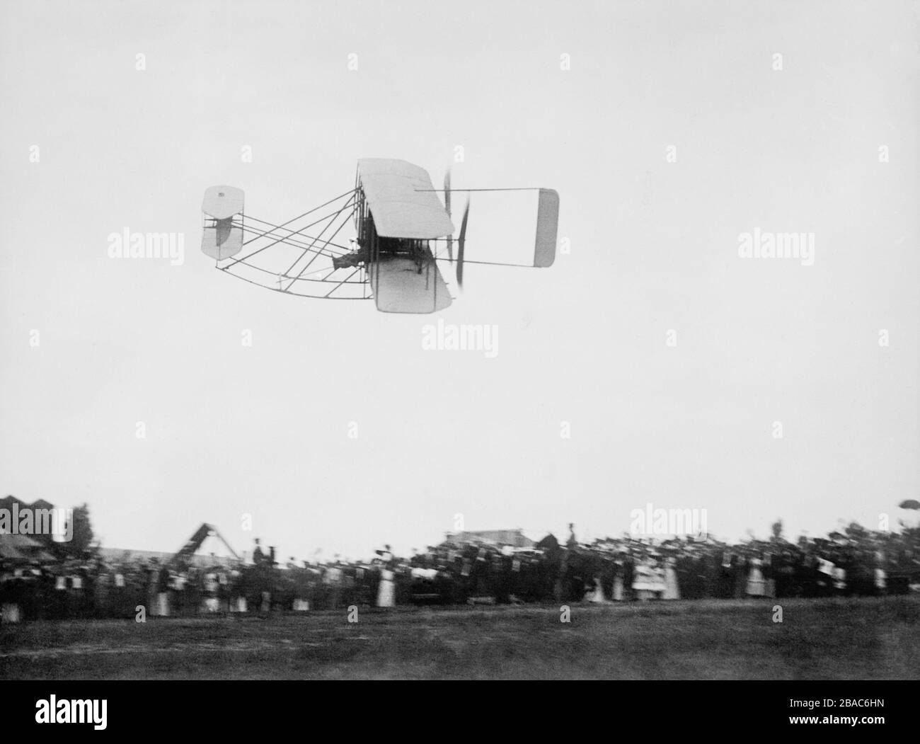 Wright Model A airplane flying above spectators at Army trial flights ...