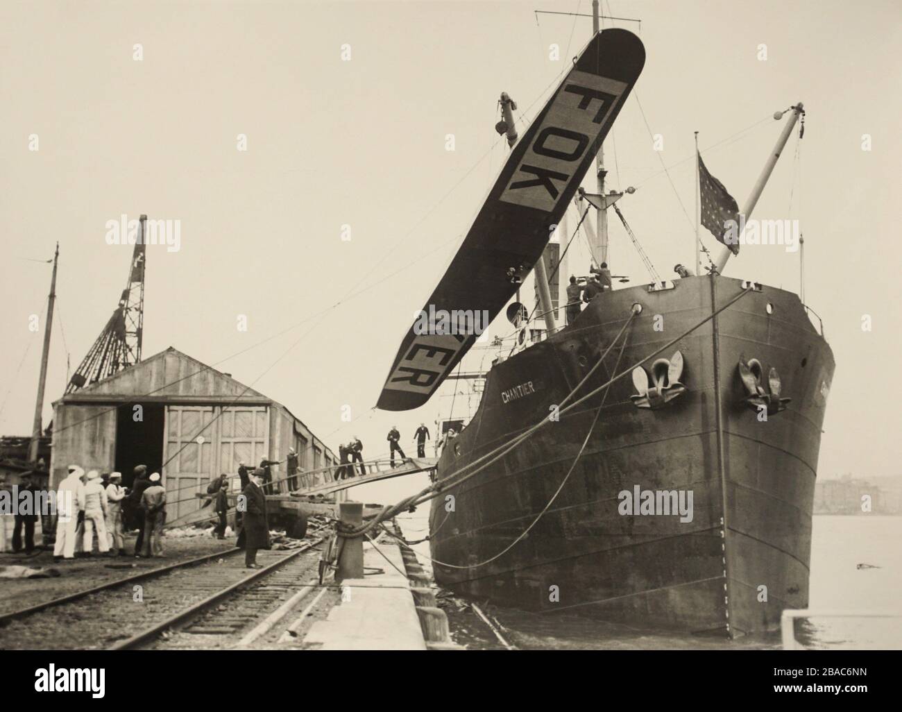 The wing of a Fokker Tri-motor monoplane hoisted above the SS Chantier ...