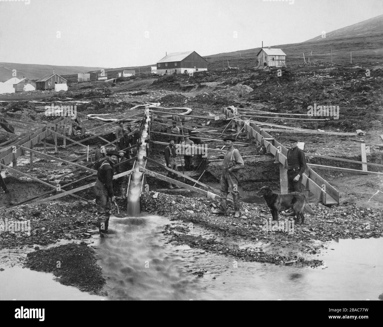 10 men work an Anvil Creek gold mine in 1916. They are in the Nome ...