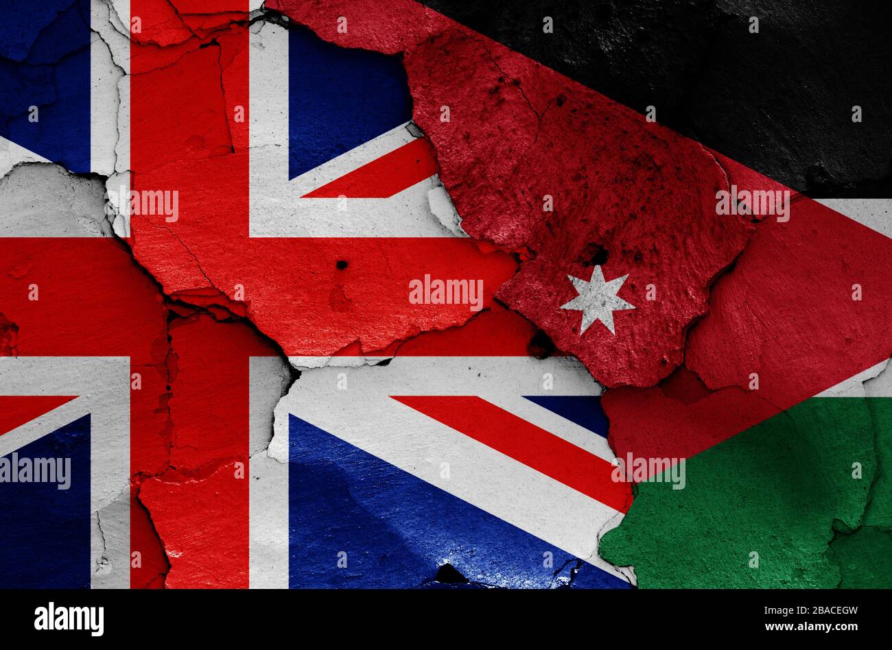 flags of UK and Jordan painted on cracked wall Stock Photo - Alamy