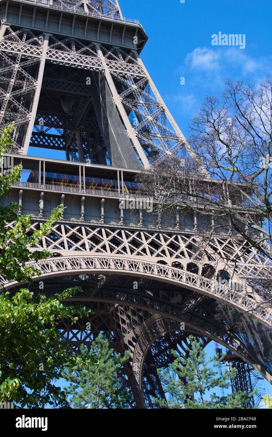 Lower Eiffel Tower seen between trees Stock Photo - Alamy Lower Eiffel Tower seen between trees Stock Photo - Alamy