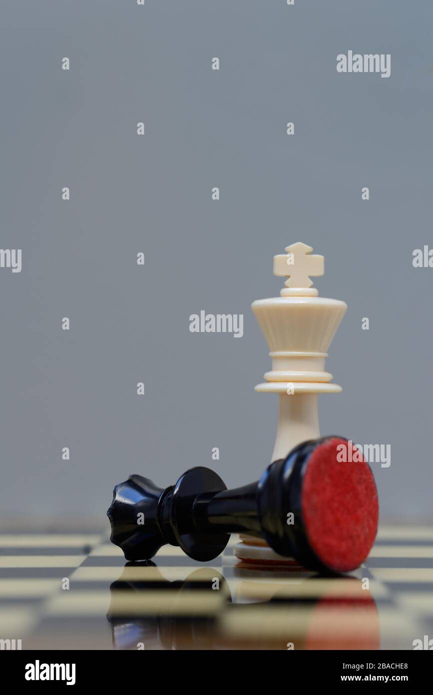 Two chessmen on chessboard, king and queen, Germany Stock Photo - Alamy