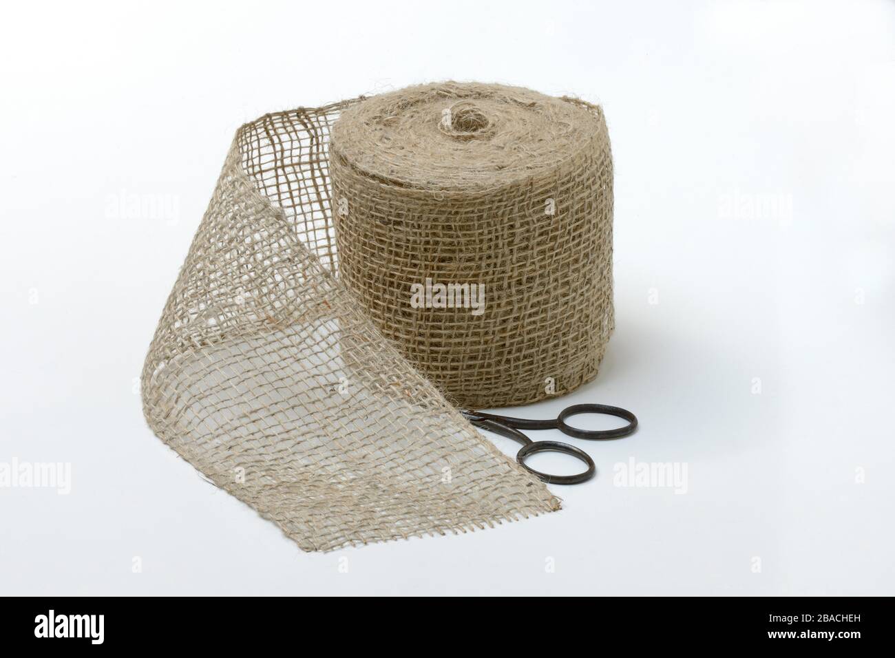 A roll of jute tape with scissors, Germany Stock Photo - Alamy