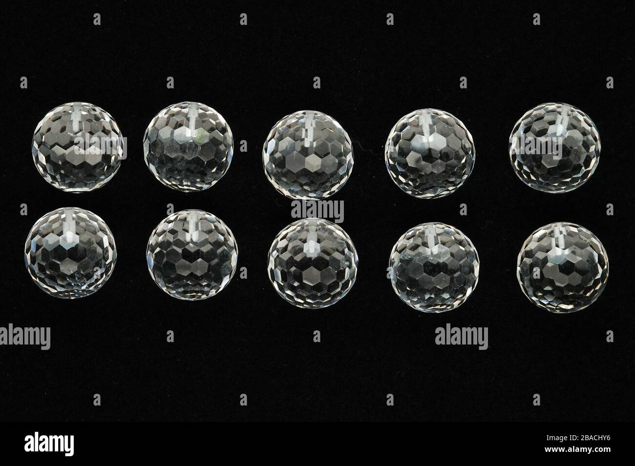 Crystal balls made of facet behind a black surface Stock Photo - Alamy