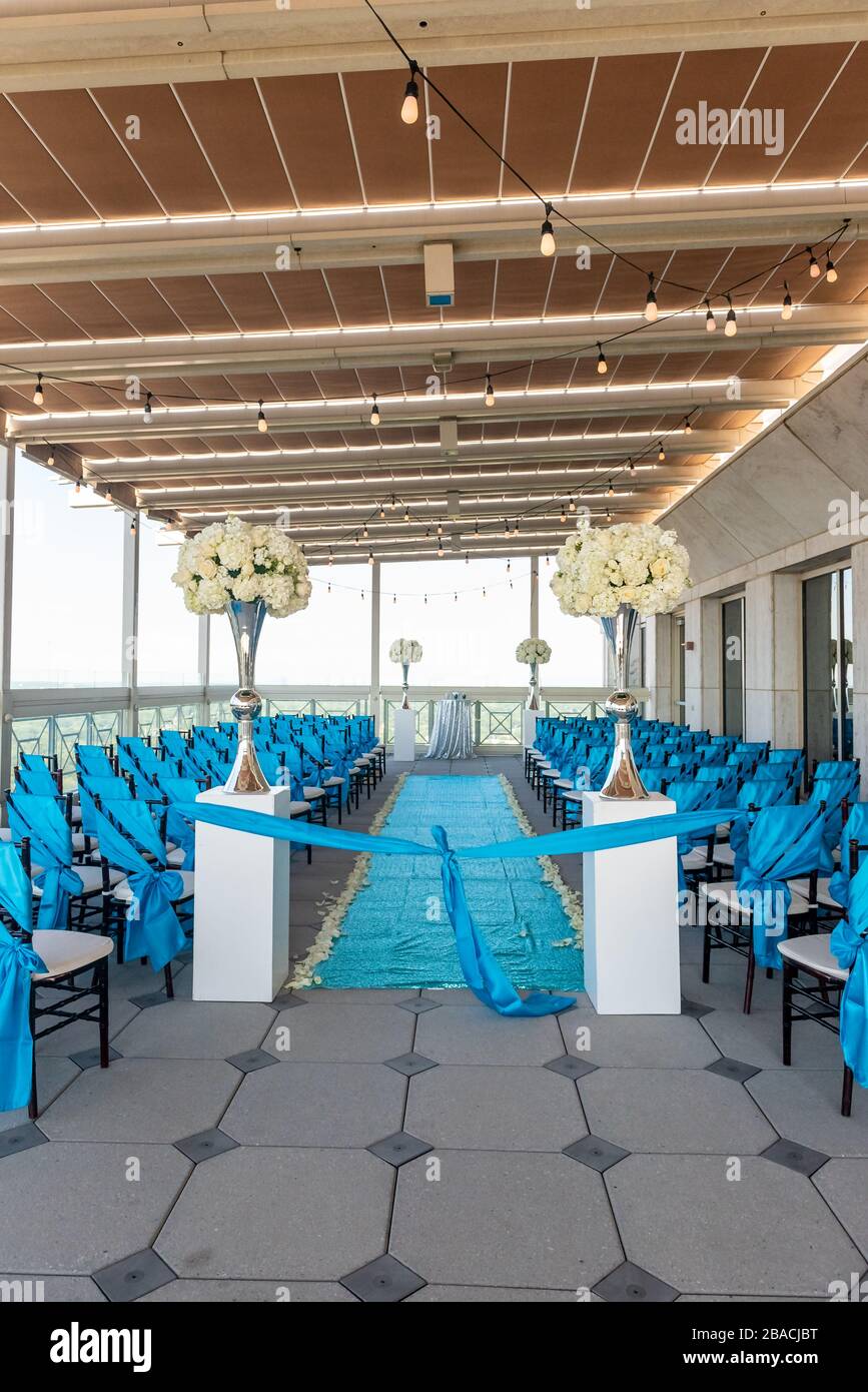 Beautiful blue-themed wedding venue with floral decorations Stock Photo ...