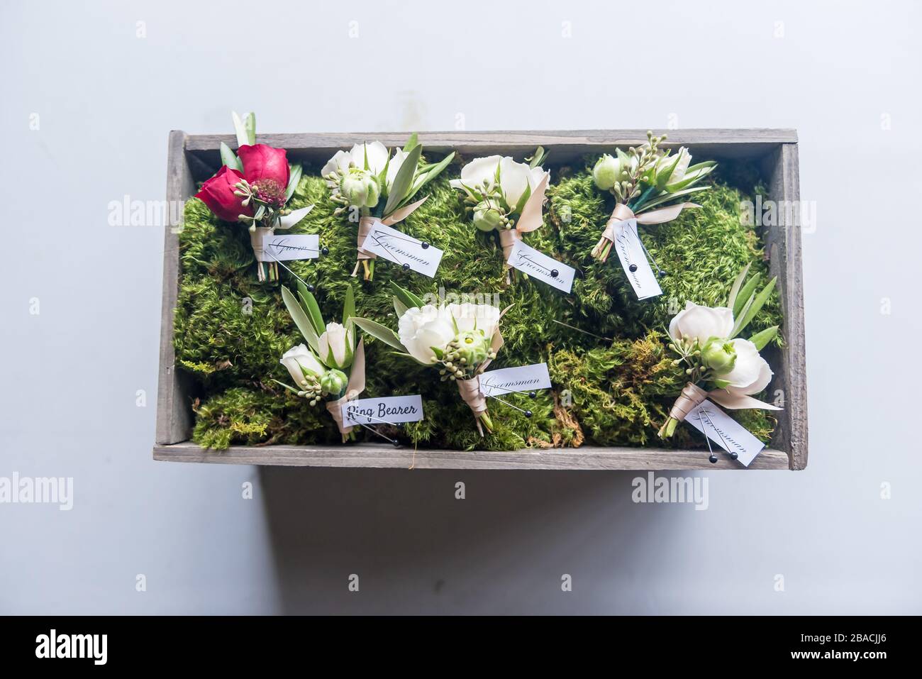Lot of beautiful wedding pocket flowers in a box Stock Photo - Alamy