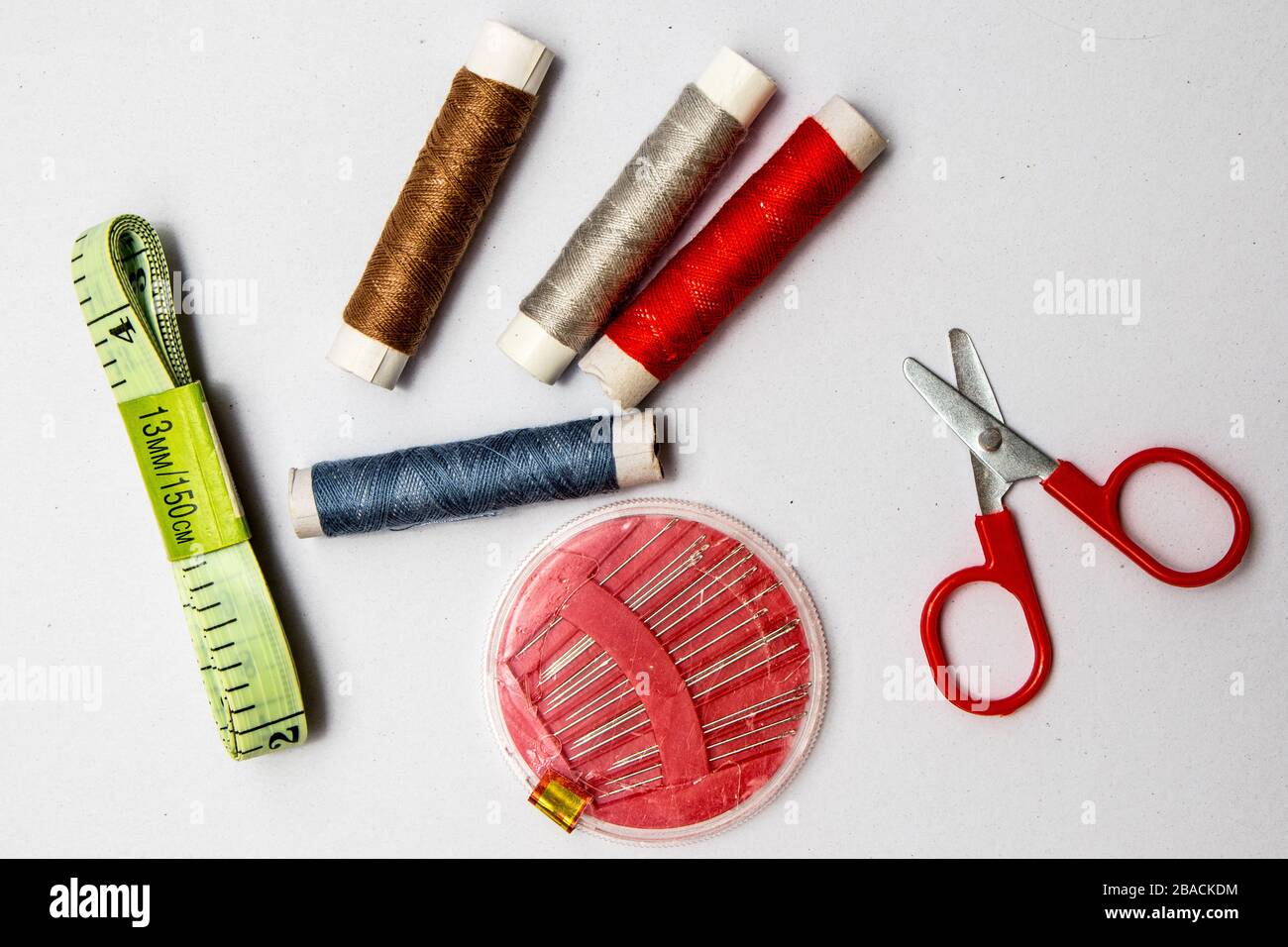 Sewing kit on white background Stock Photo - Alamy