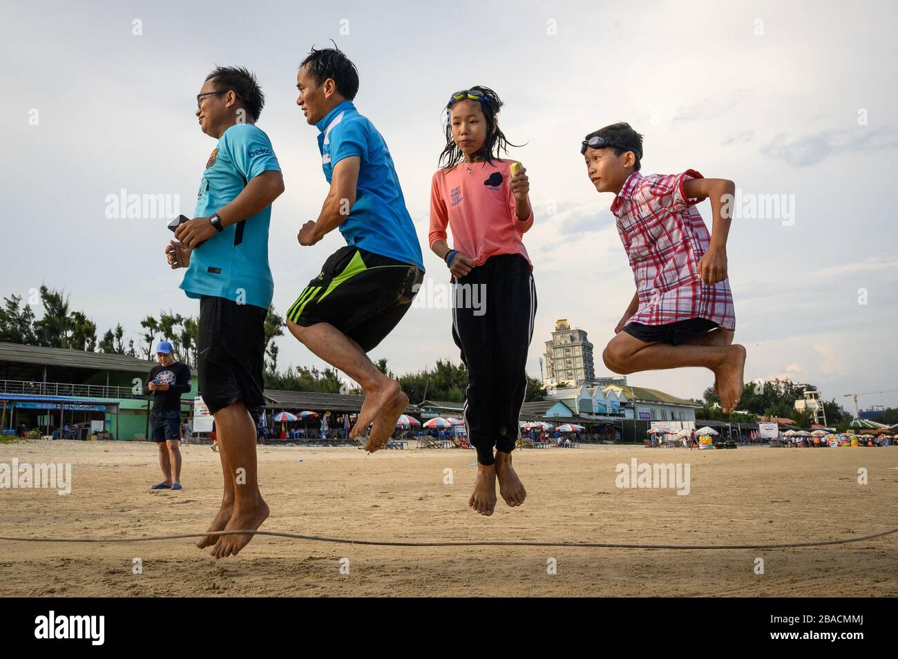 Vietnamese jumping rope at a team-building event, Back Beach, Vung Tau ...
