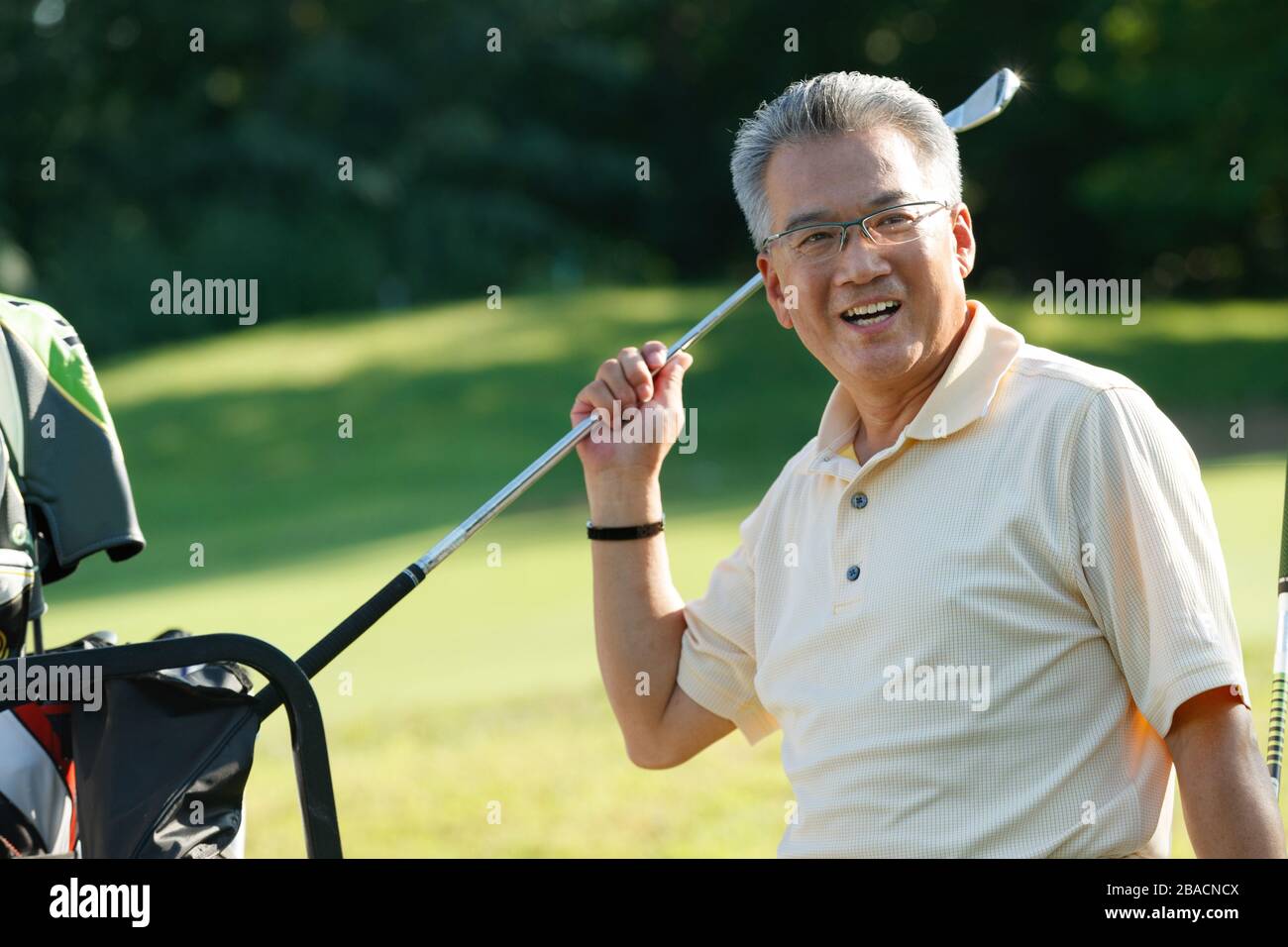 The happiness of the elderly with a golf club Stock Photo - Alamy