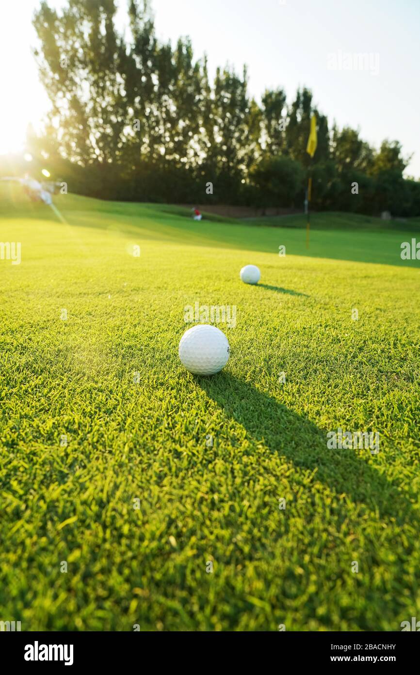 The sun's golf course with the ball Stock Photo - Alamy