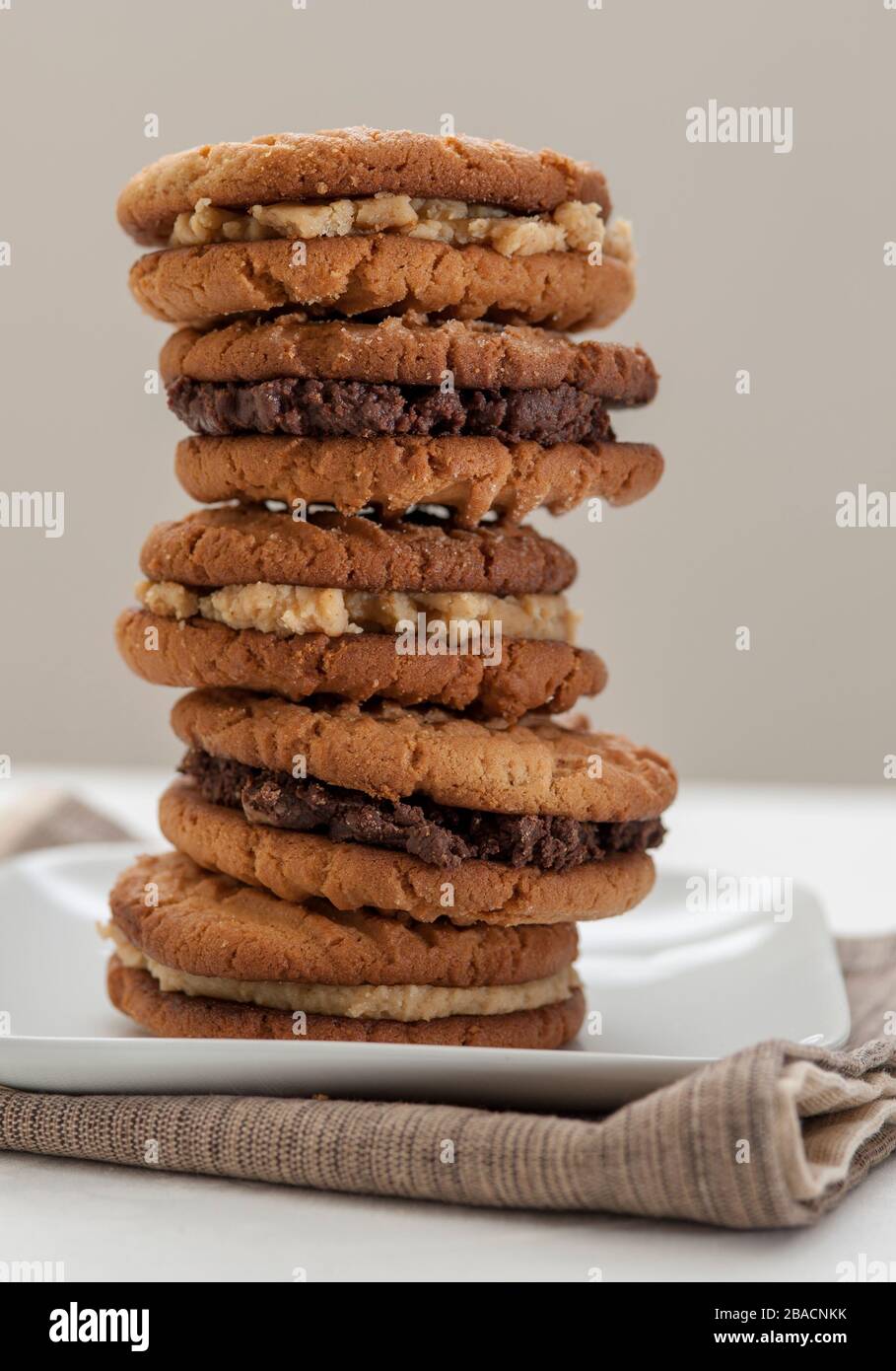 Five chocolate and peanut butter filled peanut butter cookies in a ...