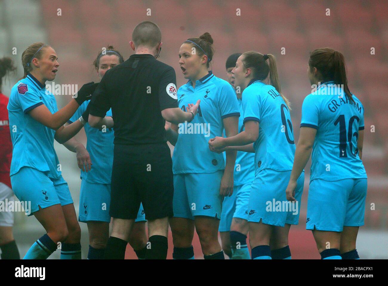 Tottenham Hotspur players surround the Referee Marc Edwards Stock Photo ...