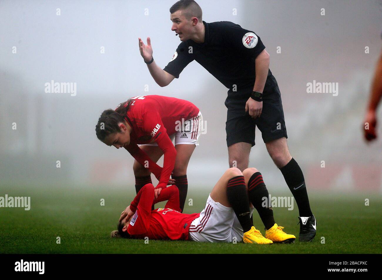 Referee Marc Edwards signals attention for injured Manchester United's ...
