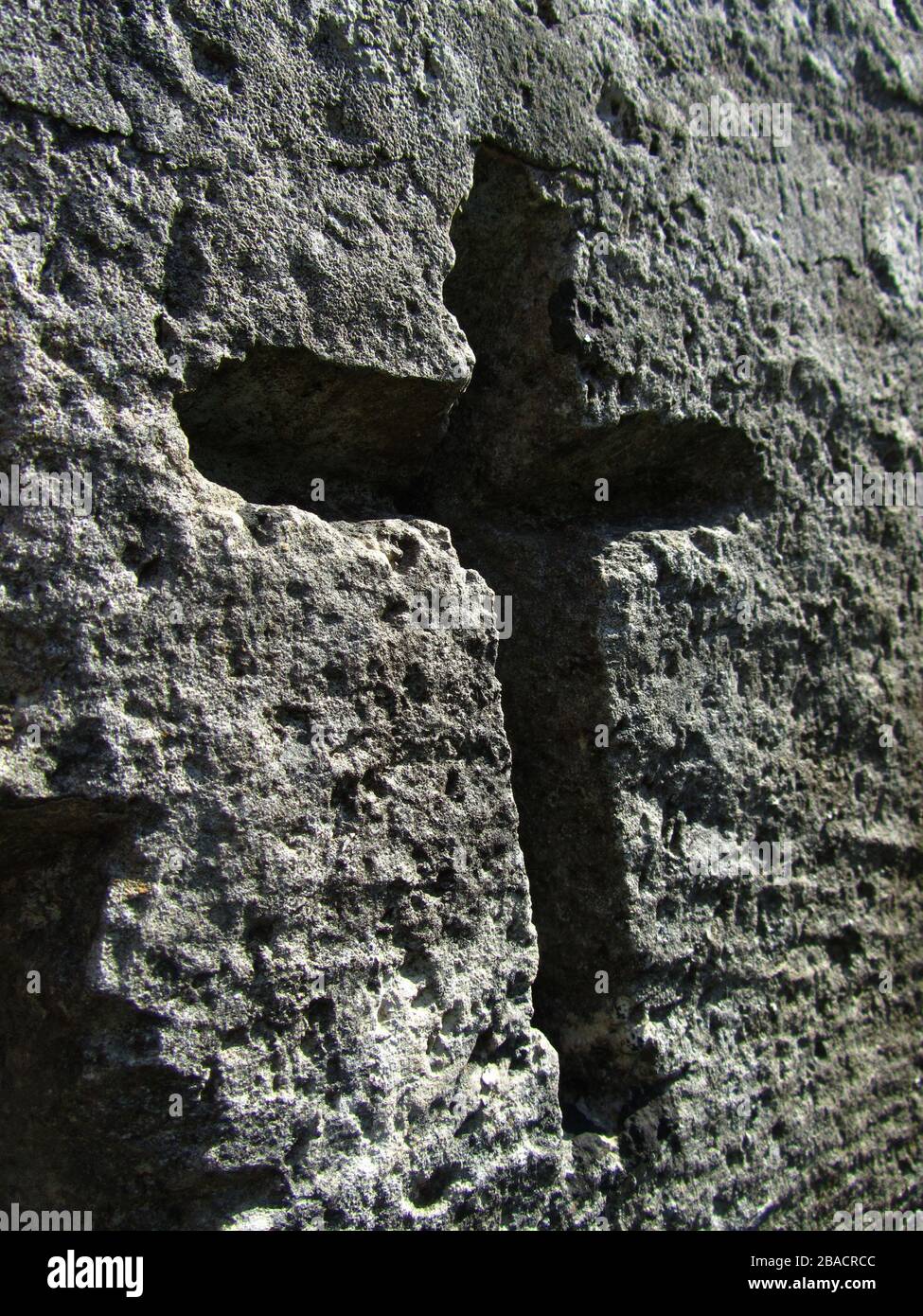 Vertical shot of the symbol of holy cross engraved in rock in Malta ...