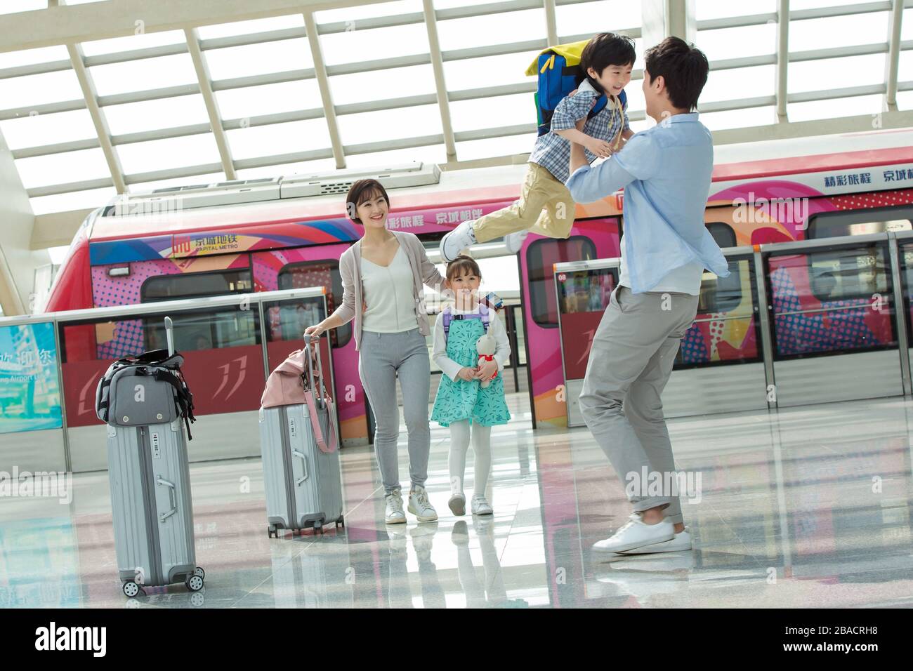 Happy family reunion hug Stock Photo - Alamy