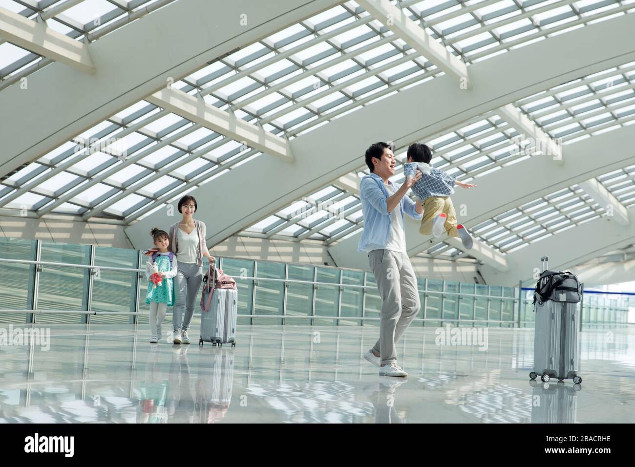 Happy family reunion hug Stock Photo - Alamy