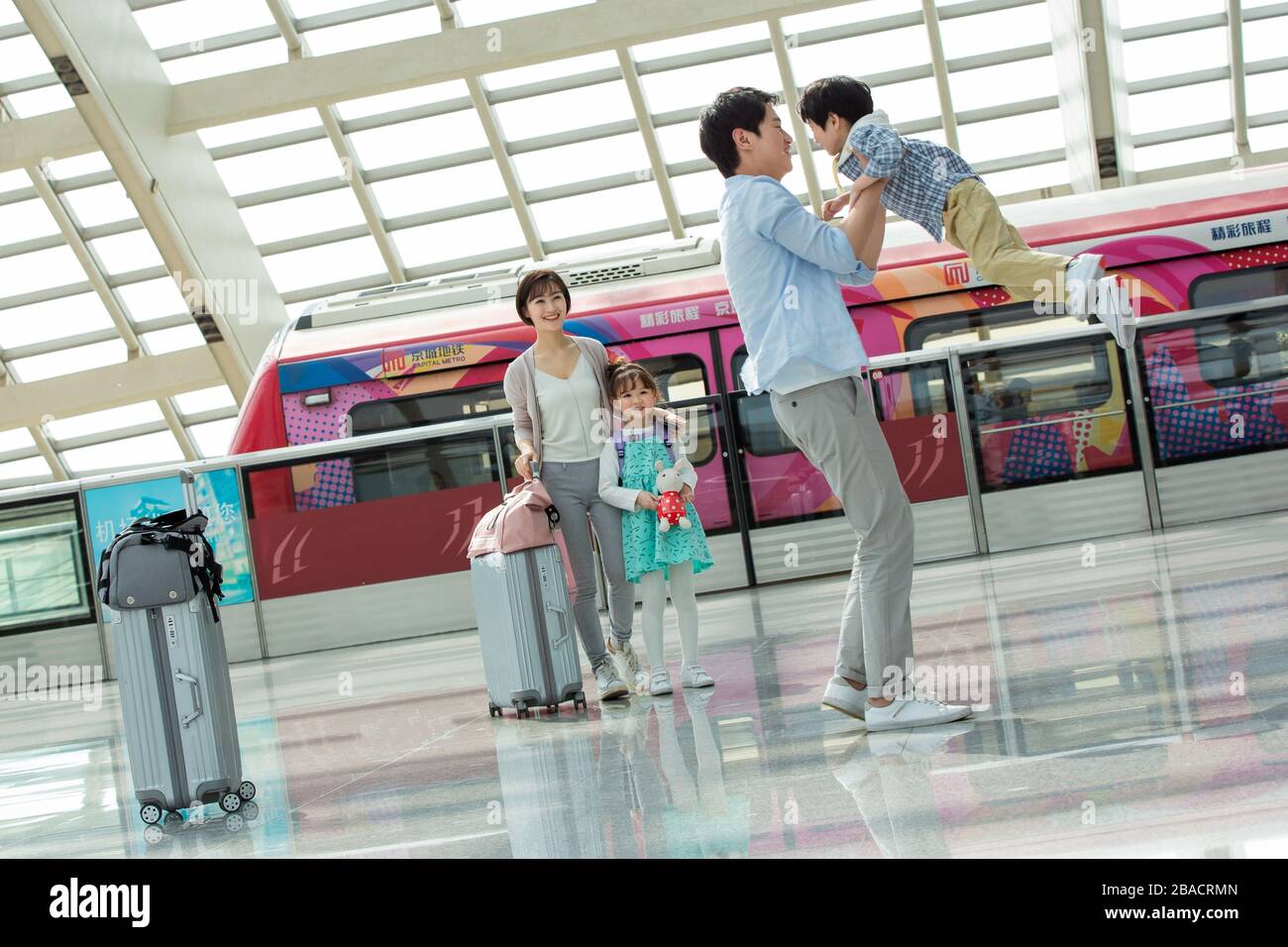 Happy family reunion hug Stock Photo - Alamy