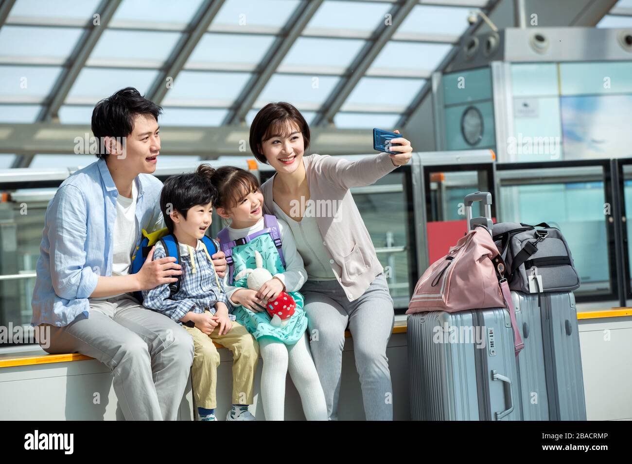 A happy family with mobile phones Stock Photo - Alamy