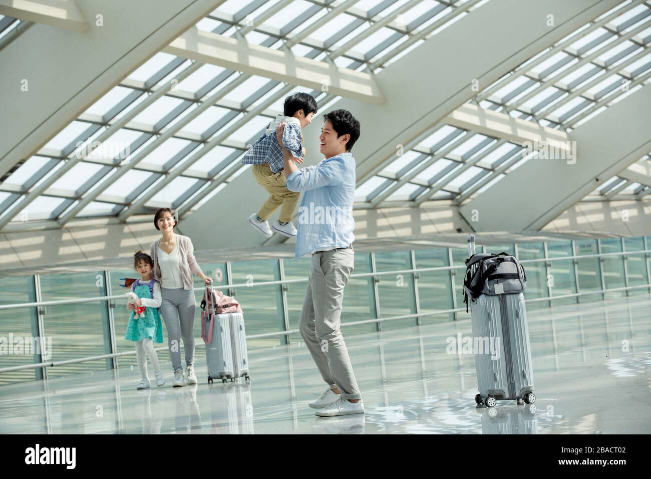 Happy family reunion hug Stock Photo - Alamy