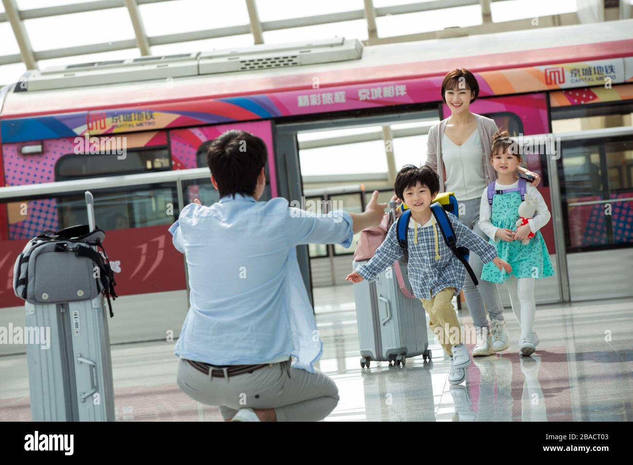 Happy family reunion hug Stock Photo - Alamy